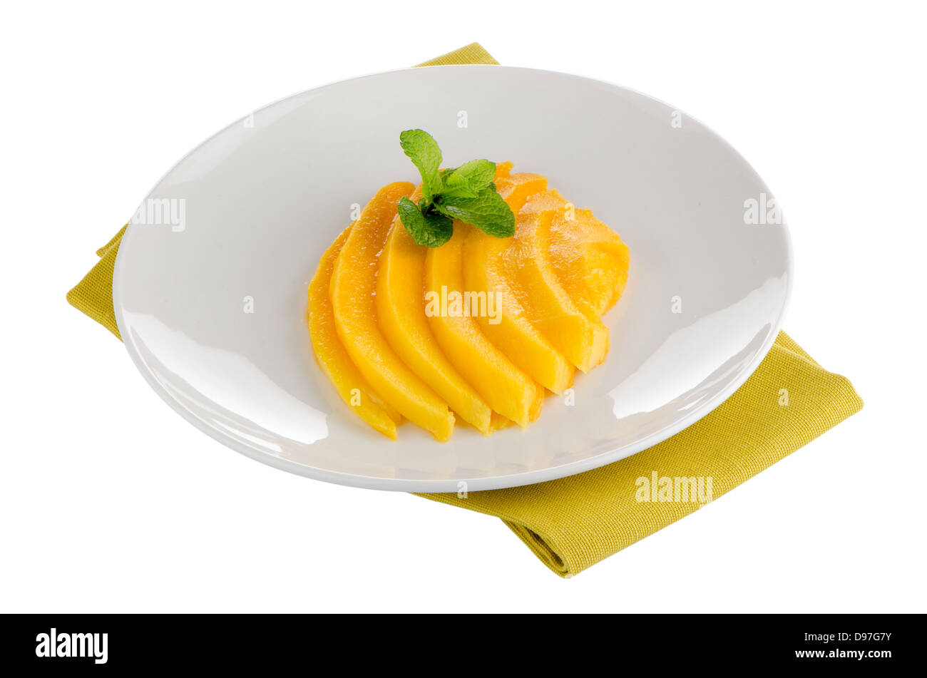 Mango fruit on white plate on white background Stock Photo - Alamy