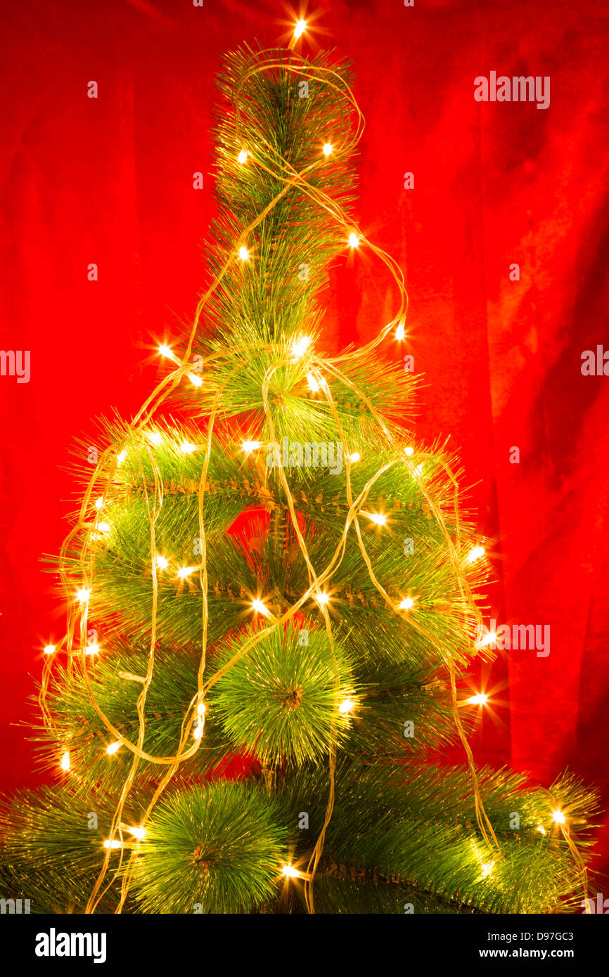 Decorated Christmas tree lit up at night Stock Photo - Alamy