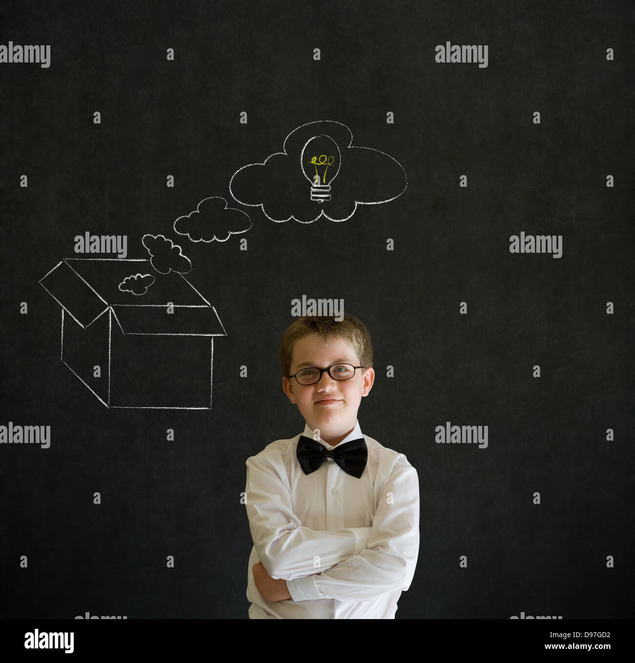 Thinking boy dressed up as business man with chalk thinking out the box ...