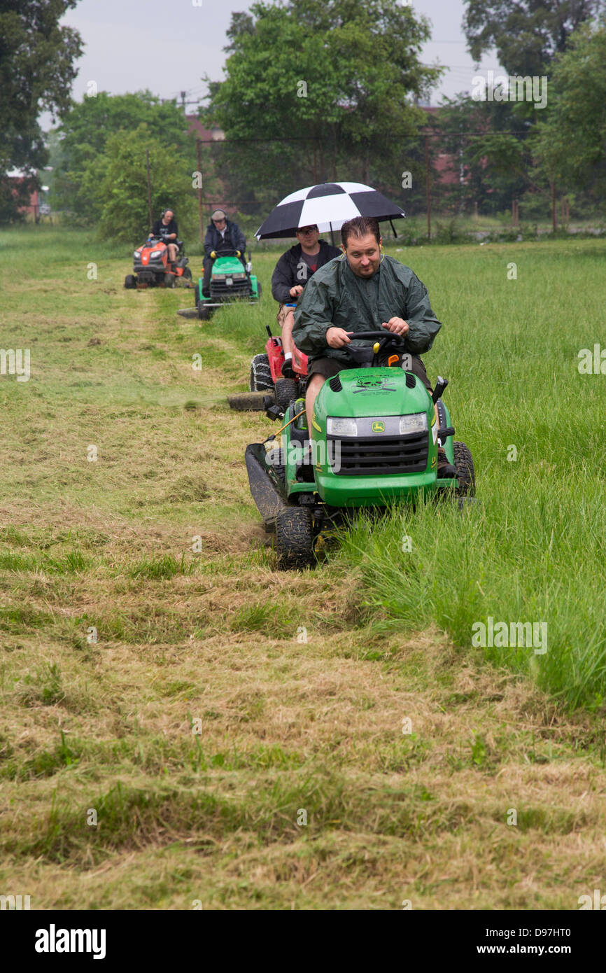 The Detroit Mower Gang, an informal group of volunteers, cuts the grass ...