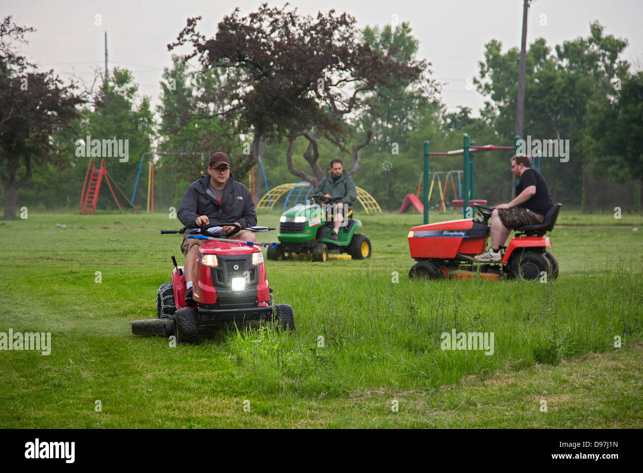The Detroit Mower Gang, an informal group of volunteers, cuts the grass ...