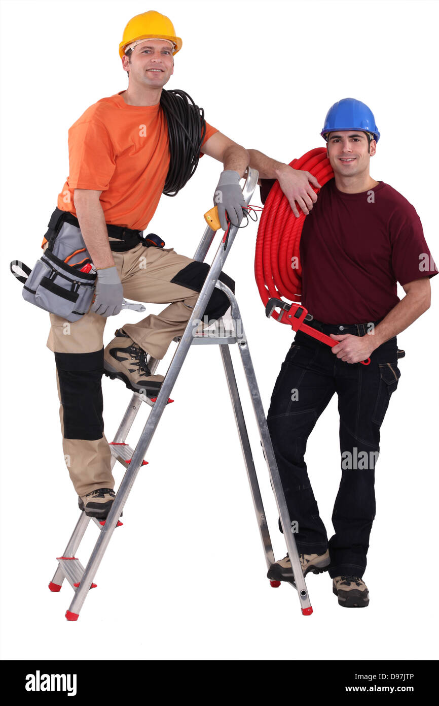 A team of tradesmen posing with their tools Stock Photo - Alamy