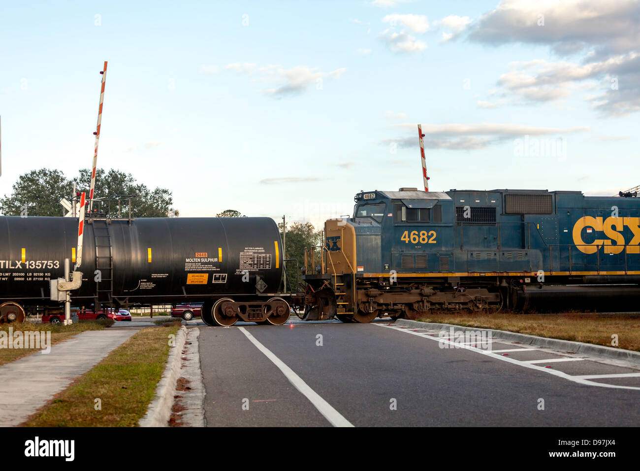 CSX engine 4682 pulling a freight train including a black tank car ...