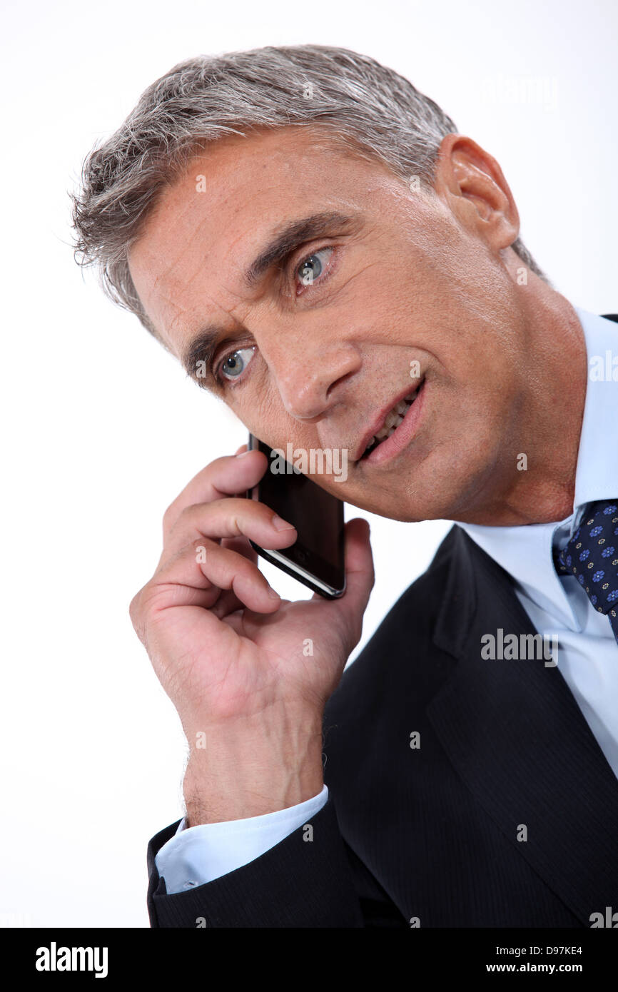 Director talking on phone on white background Stock Photo - Alamy
