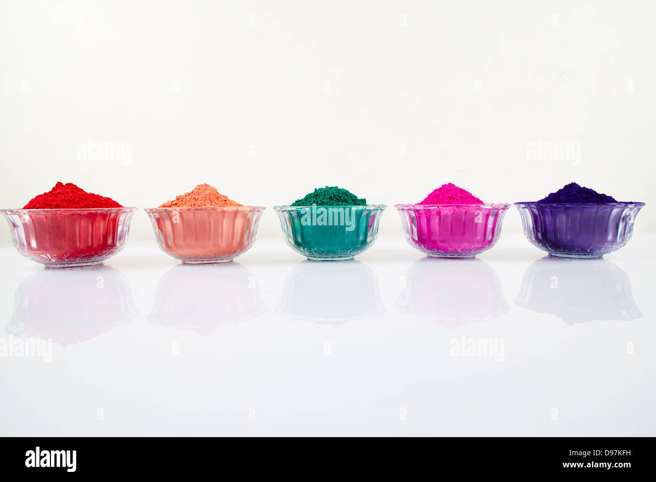 Close-up of bowls of various colors in a row Stock Photo - Alamy