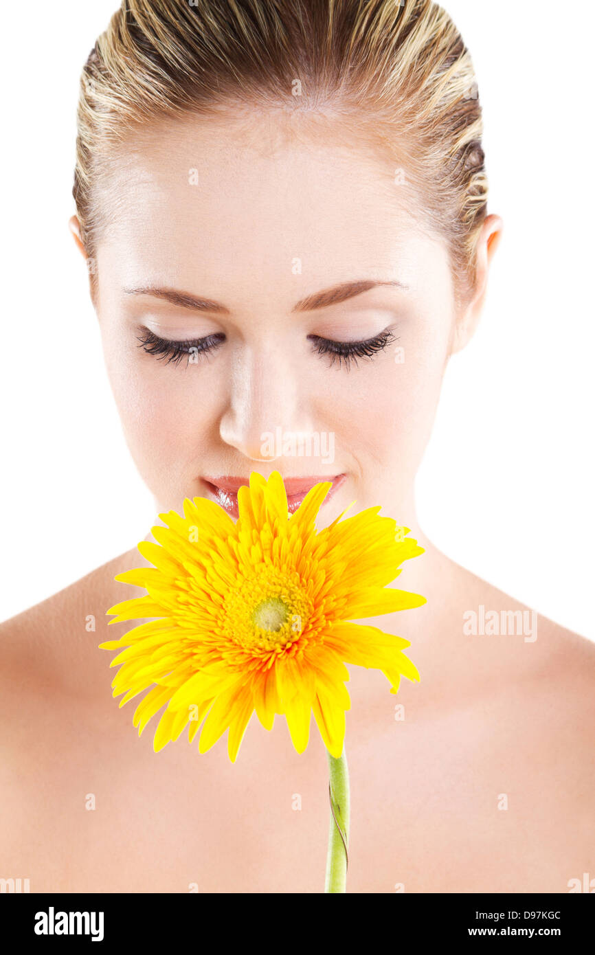beautiful young woman smelling flower on white Stock Photo - Alamy