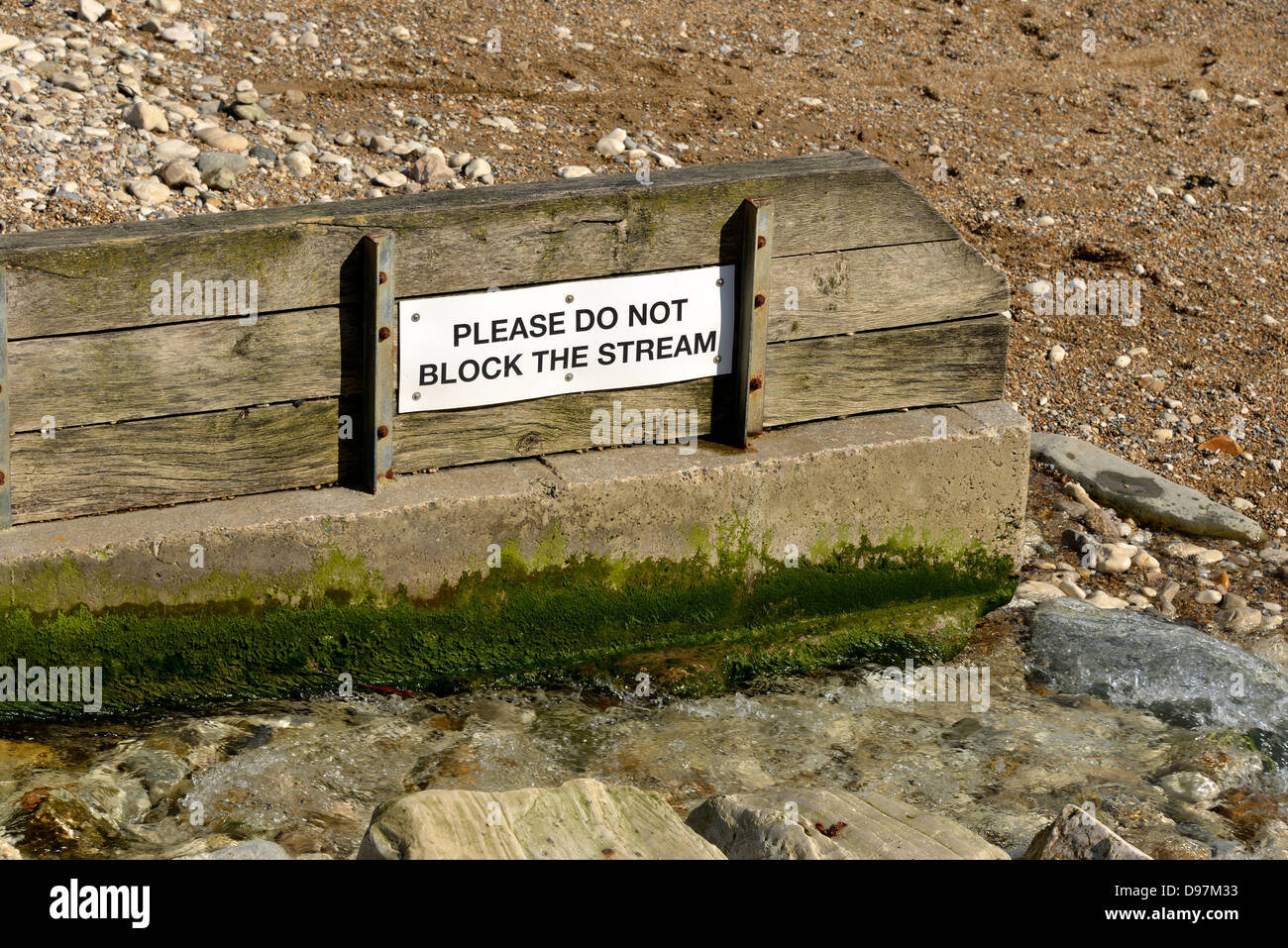Please do no block the stream sign at Lulworth Cove Dorset Stock Photo ...