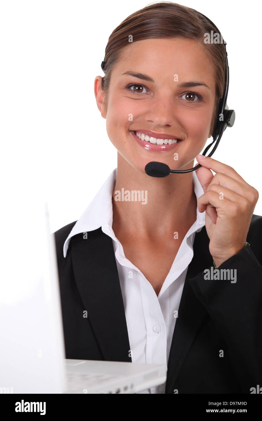 Receptionist with headset and computer Stock Photo - Alamy
