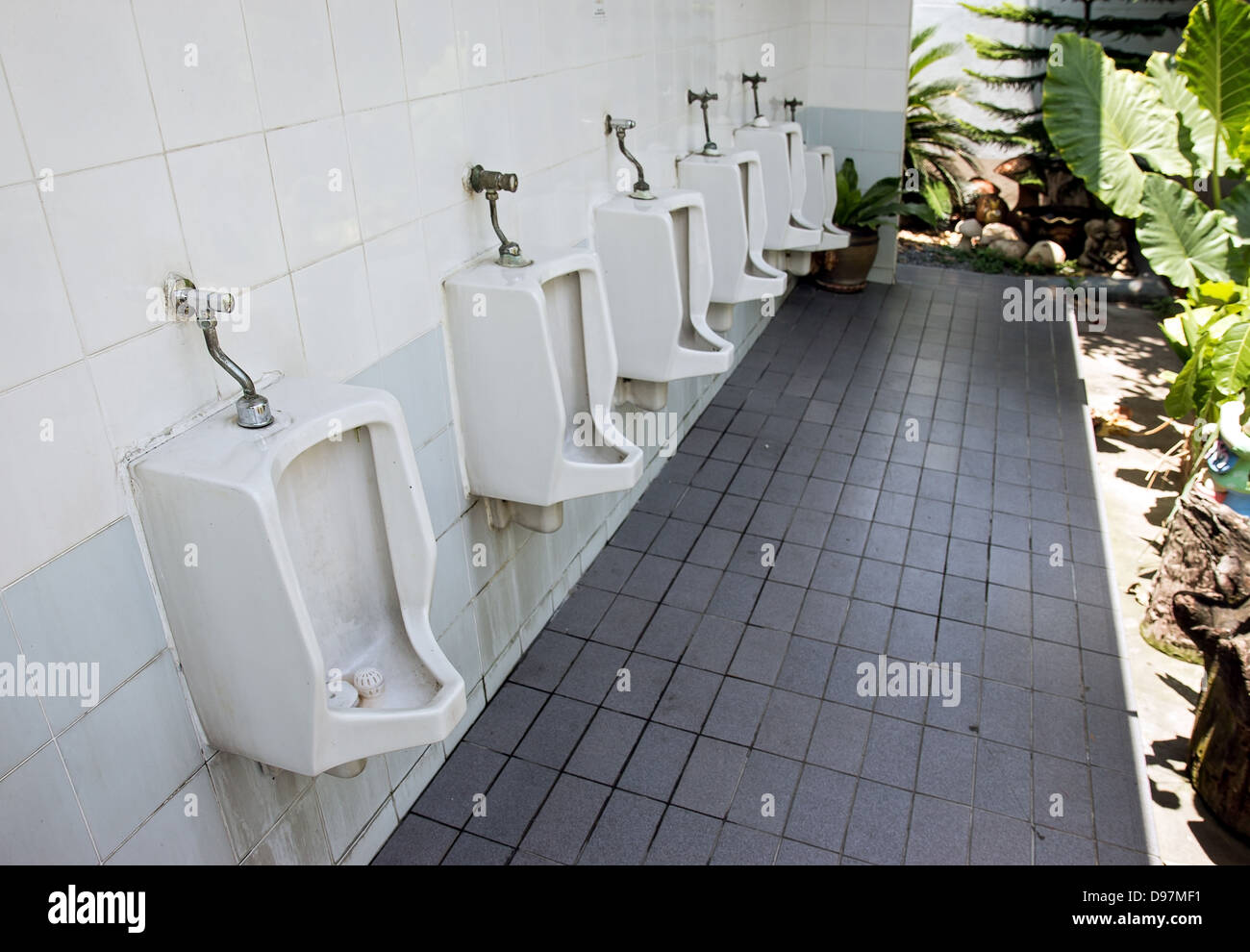 restroom outdoor with urinal row Stock Photo - Alamy