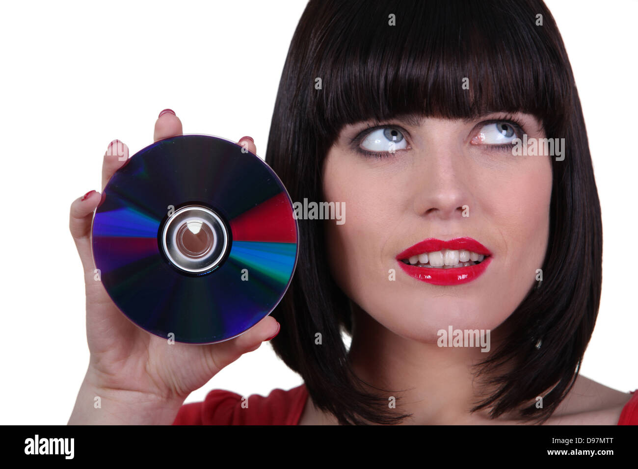 Woman showing CD Stock Photo - Alamy