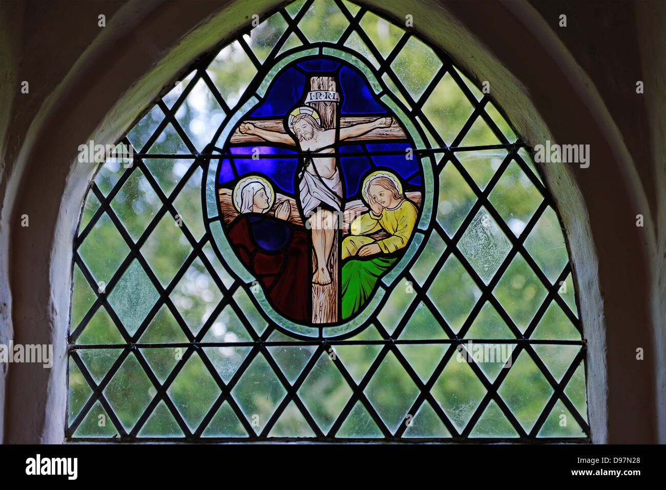 A mediaeval stained glass church window depicting the Crucifixion Stock ...