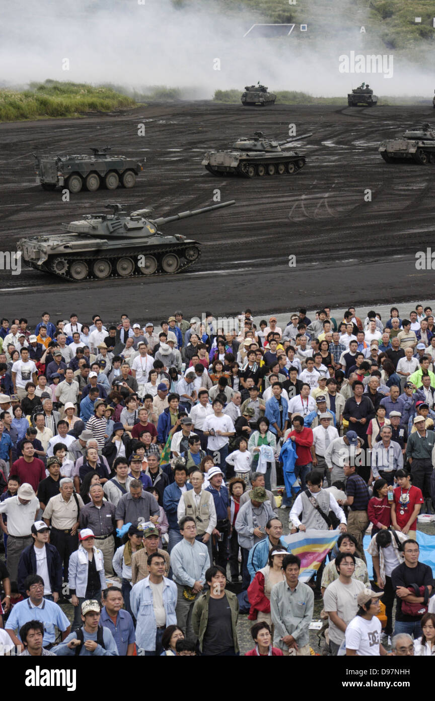 Spectators watch as Japan Ground Self-Defense Forces (GSDF) take part ...