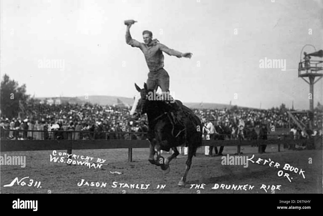 A photograph capturing cowboy Jason Stanley performing a riding trick ...