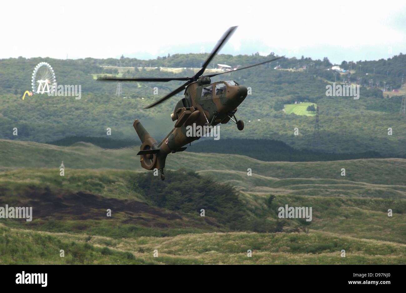 A helicopter of the Japan Ground Self-Defense Forces takes part in a ...