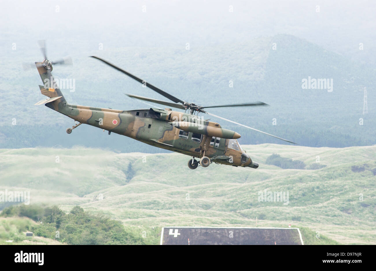 A helicopter of the Japan Ground Self-Defense Forces takes part in a ...