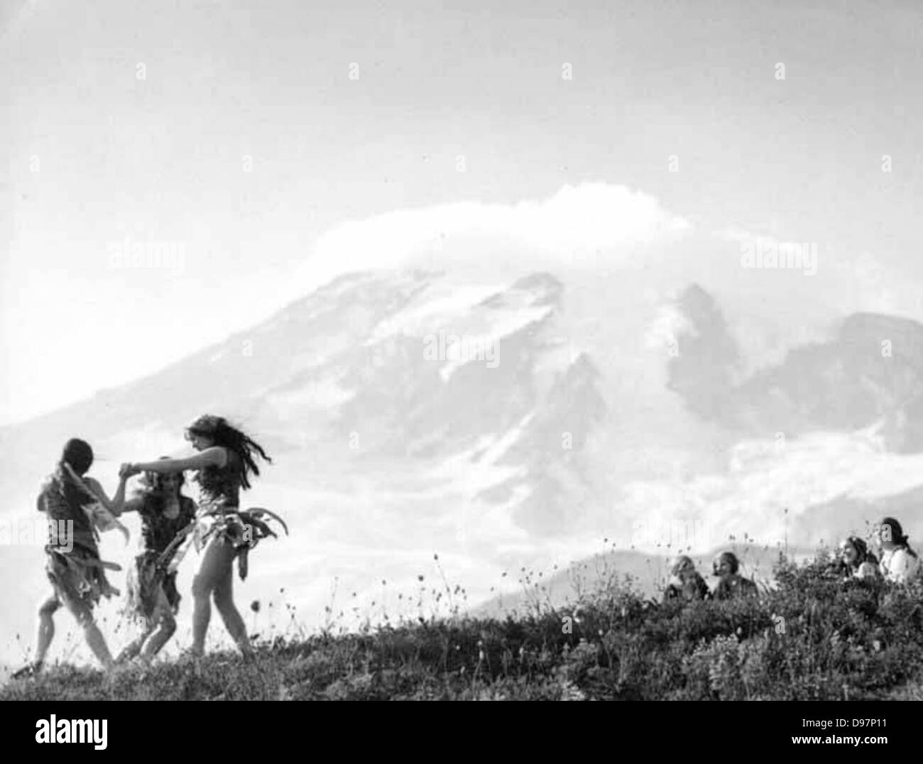 A photograph of three dancers dressed as gypsies, performing in a field ...