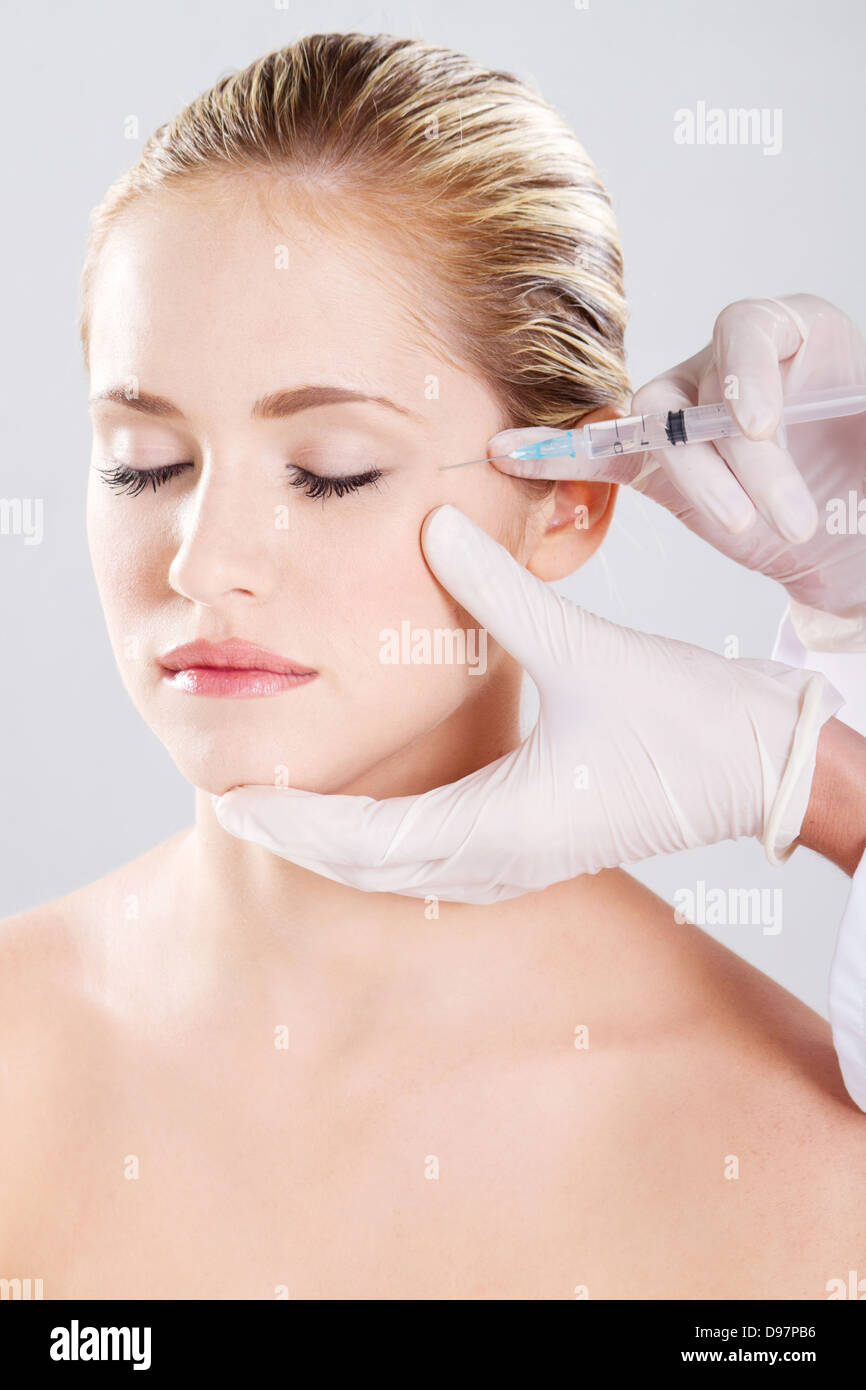 injection shot in the female face Stock Photo - Alamy