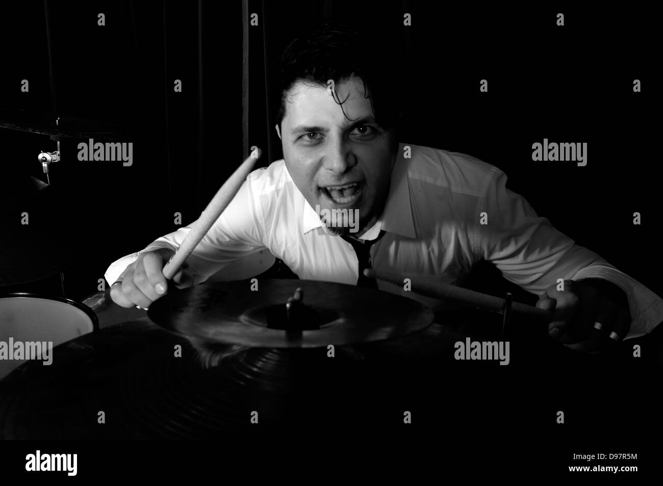 Mad male drummer in low key Stock Photo - Alamy