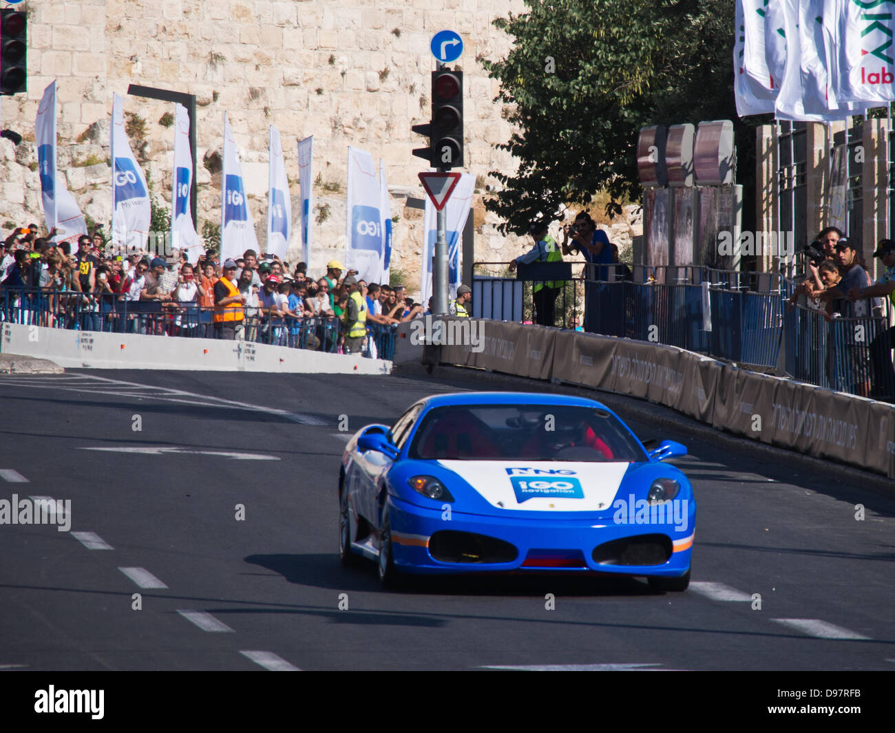 A Ferrari 430 GT Challenge passes below the Old City's Jaffa Gate as ...