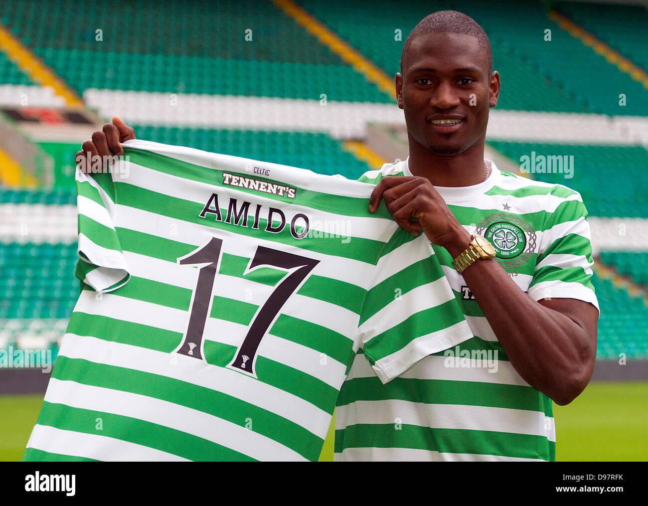 Glasgow, Scotland, UK. 13th June 2013. Amido Balde parades with his new ...