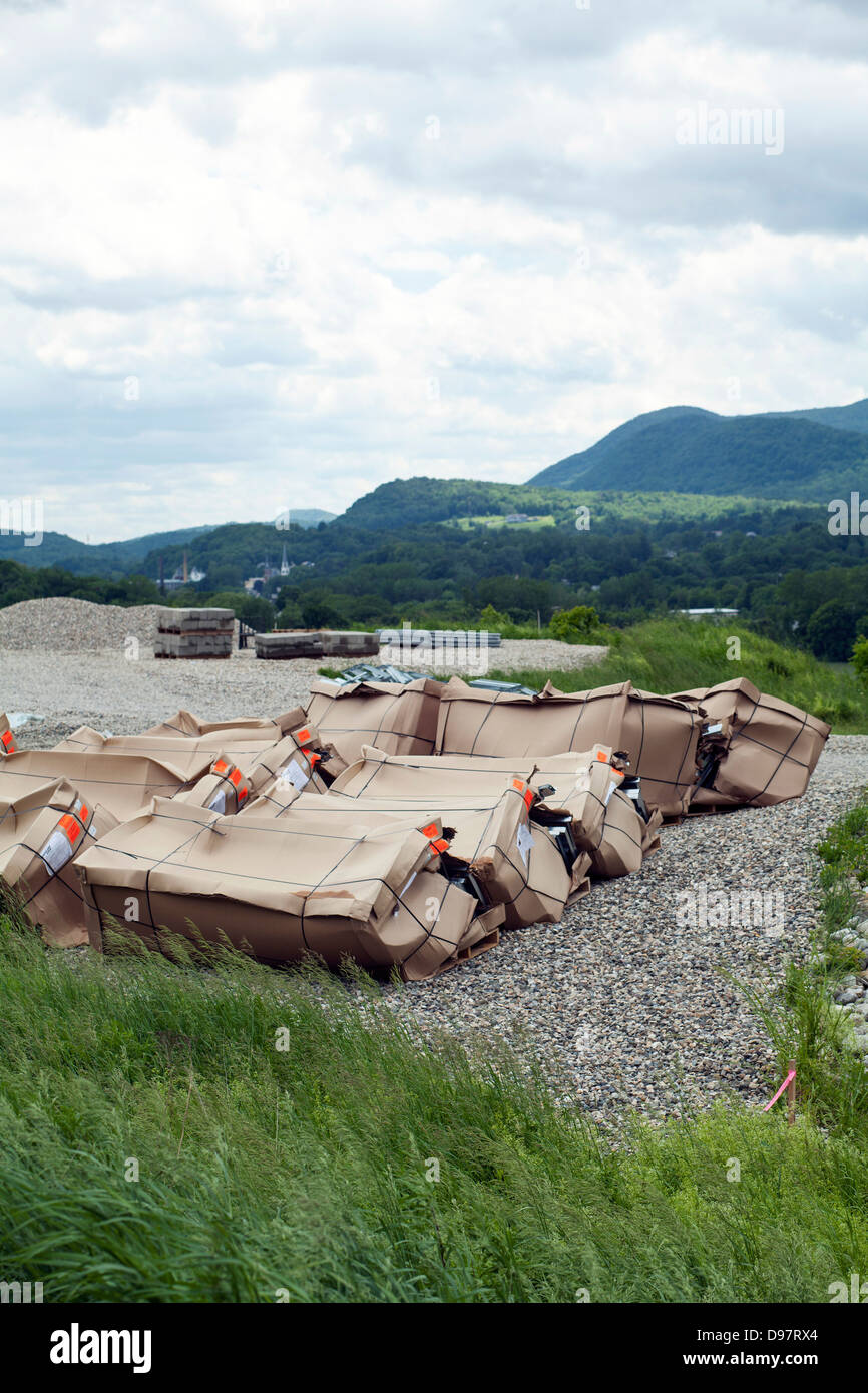 Soggy boxes of solar array equipment await installation in Adams ...