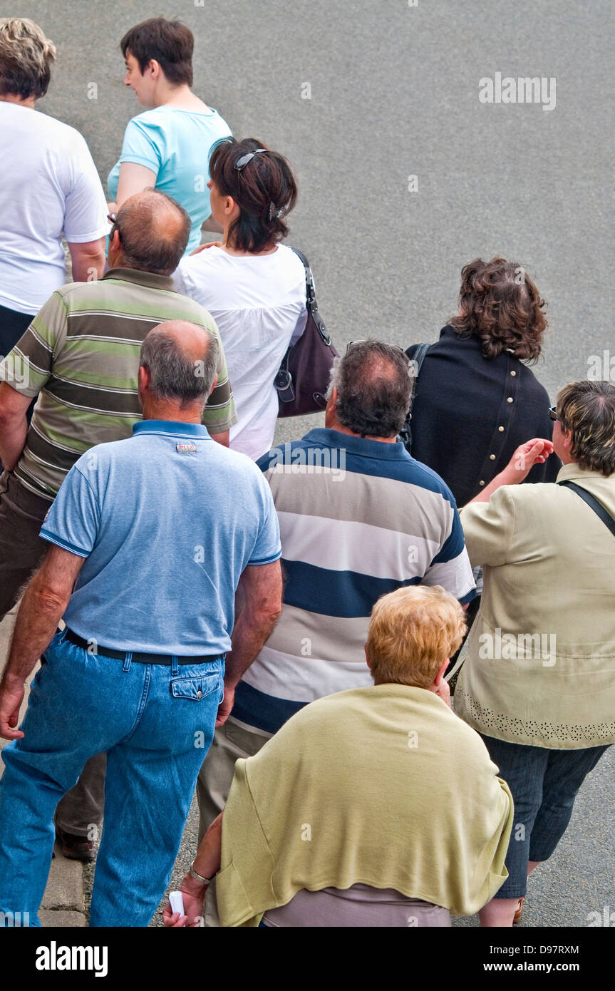Group of people walking along pavement - France Stock Photo - Alamy