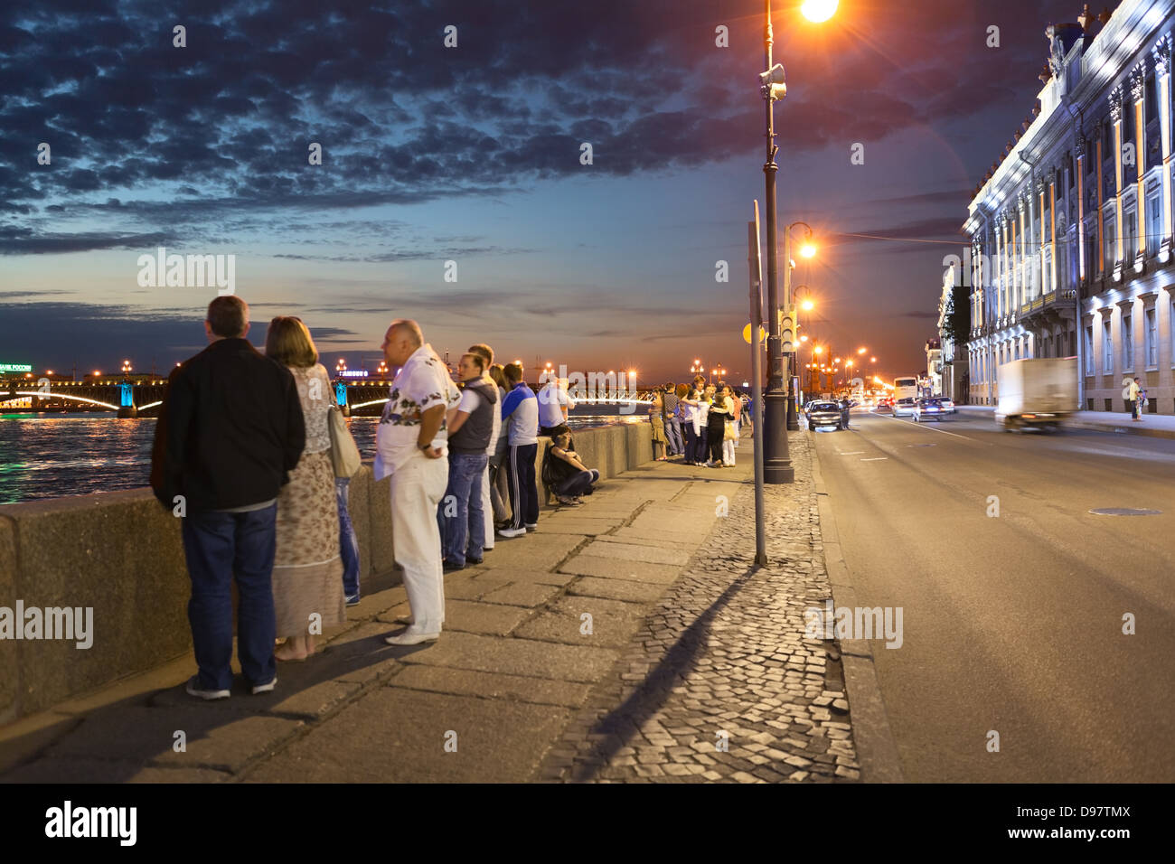 People on granite embankment wait bridge raising after midnight on ...
