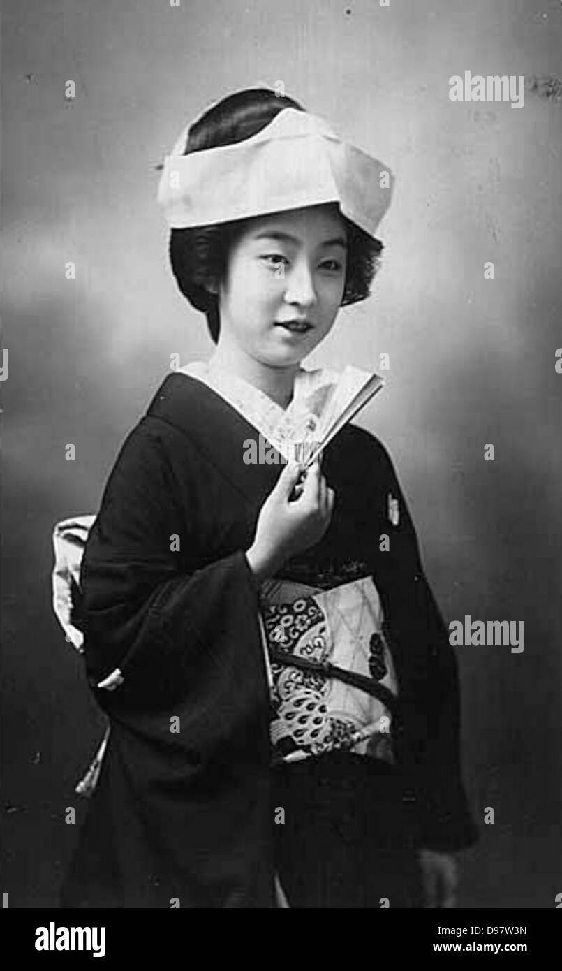 This portrait shows a Japanese woman, possibly a Geisha, wearing ...