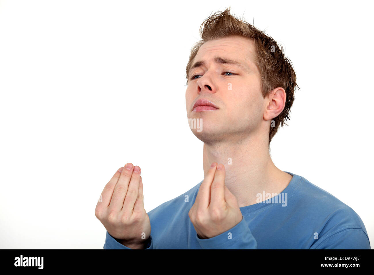Young man imploring Stock Photo - Alamy