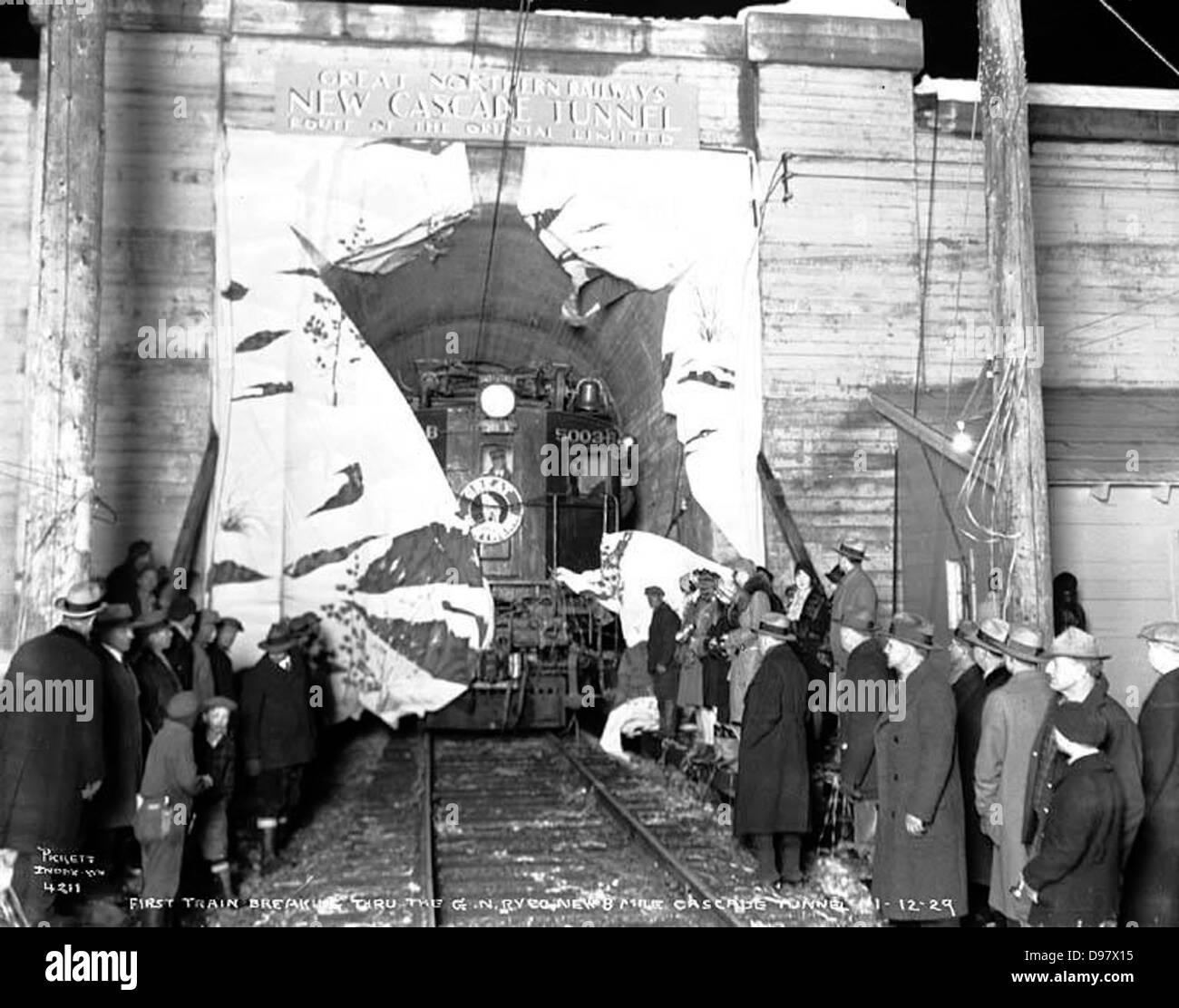 This photograph captures the moment the first train breaks through the ...
