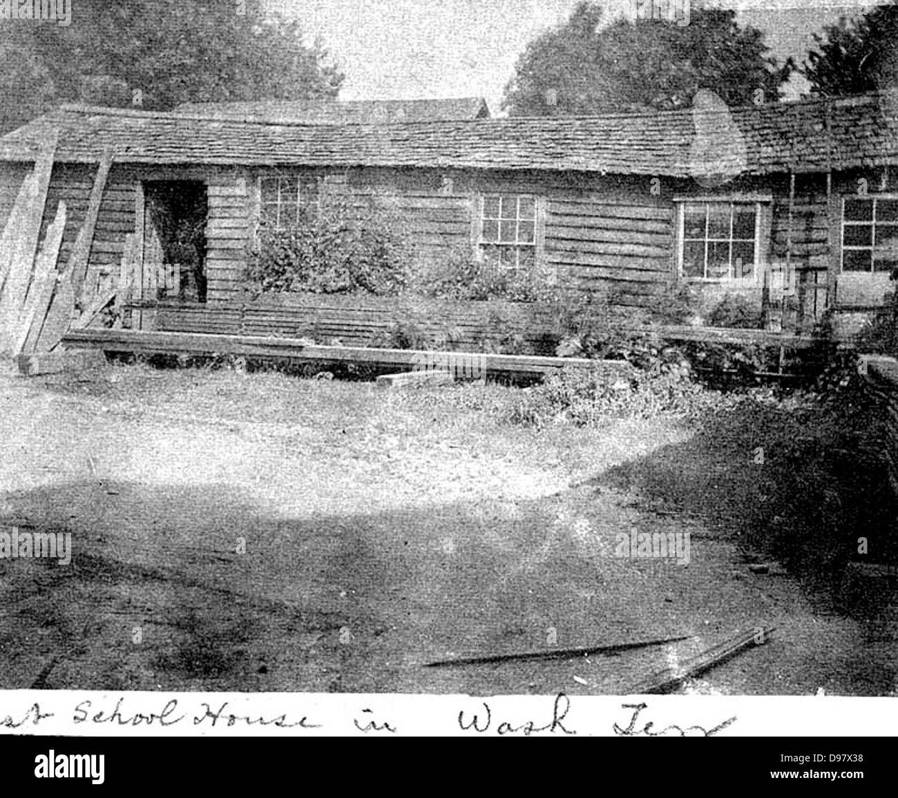 This photograph shows the first schoolhouse in Olympia, Washington, a ...