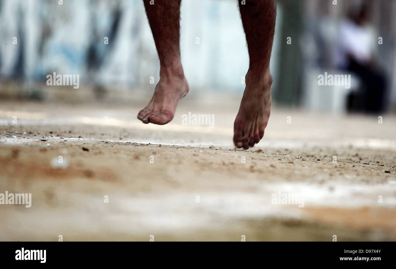 June 13, 2013 - Gaza City, Gaza Strip - A Palestinian runner competes ...