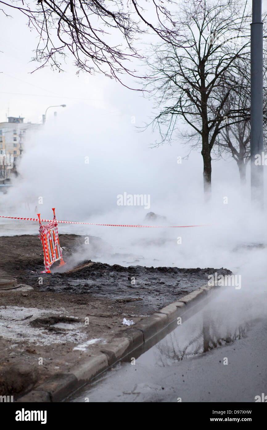 Accident on a heating main, pipe break on city street. Dangerous sign ...