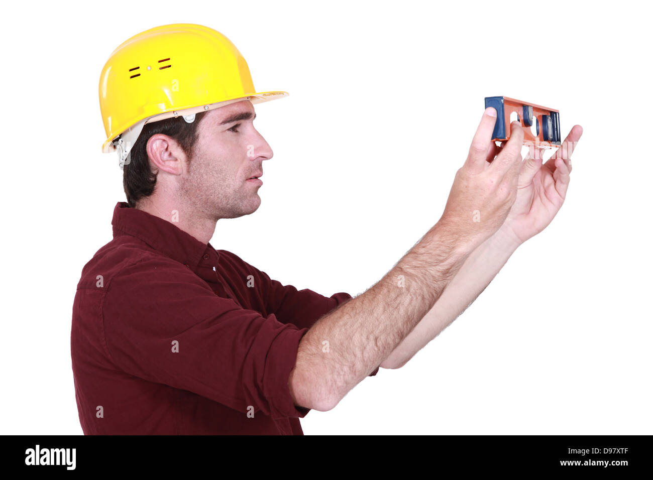 Man using spirit-level Stock Photo - Alamy