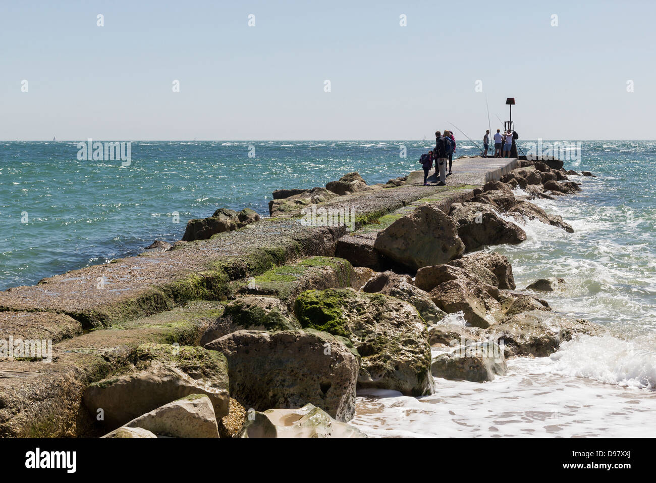 Fishing and recreation on long groyne / pier at Hengistbury Head ...