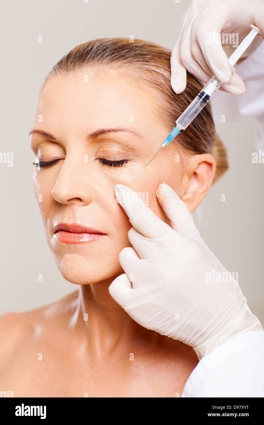 senior woman receiving plastic surgery injection on her face Stock ...