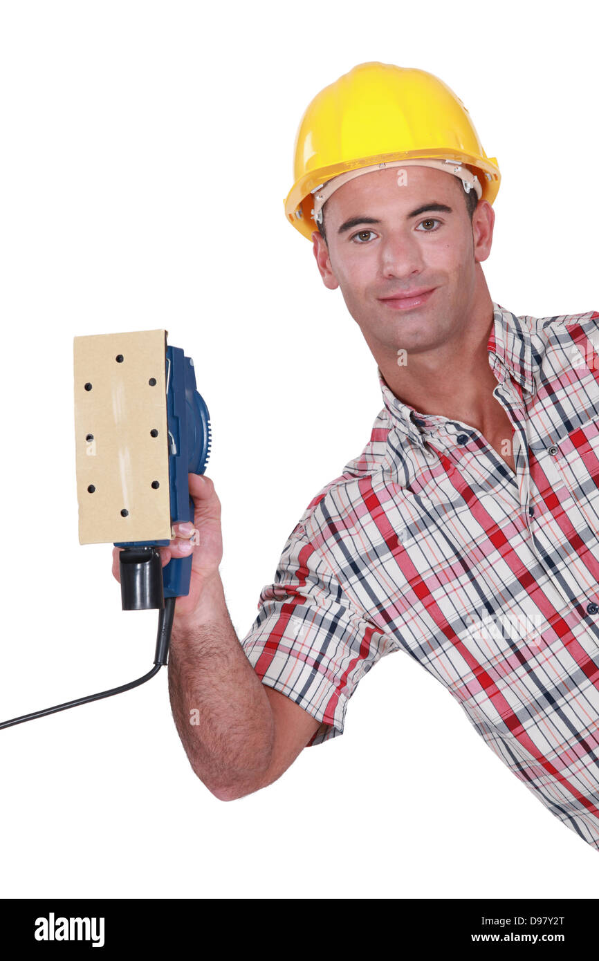 Worker with a sander Stock Photo - Alamy