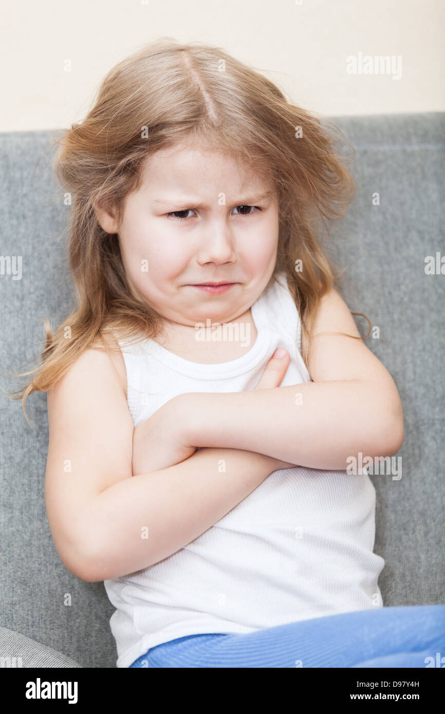 Portrait of resentful Caucasian young girl with arms folded Stock Photo ...