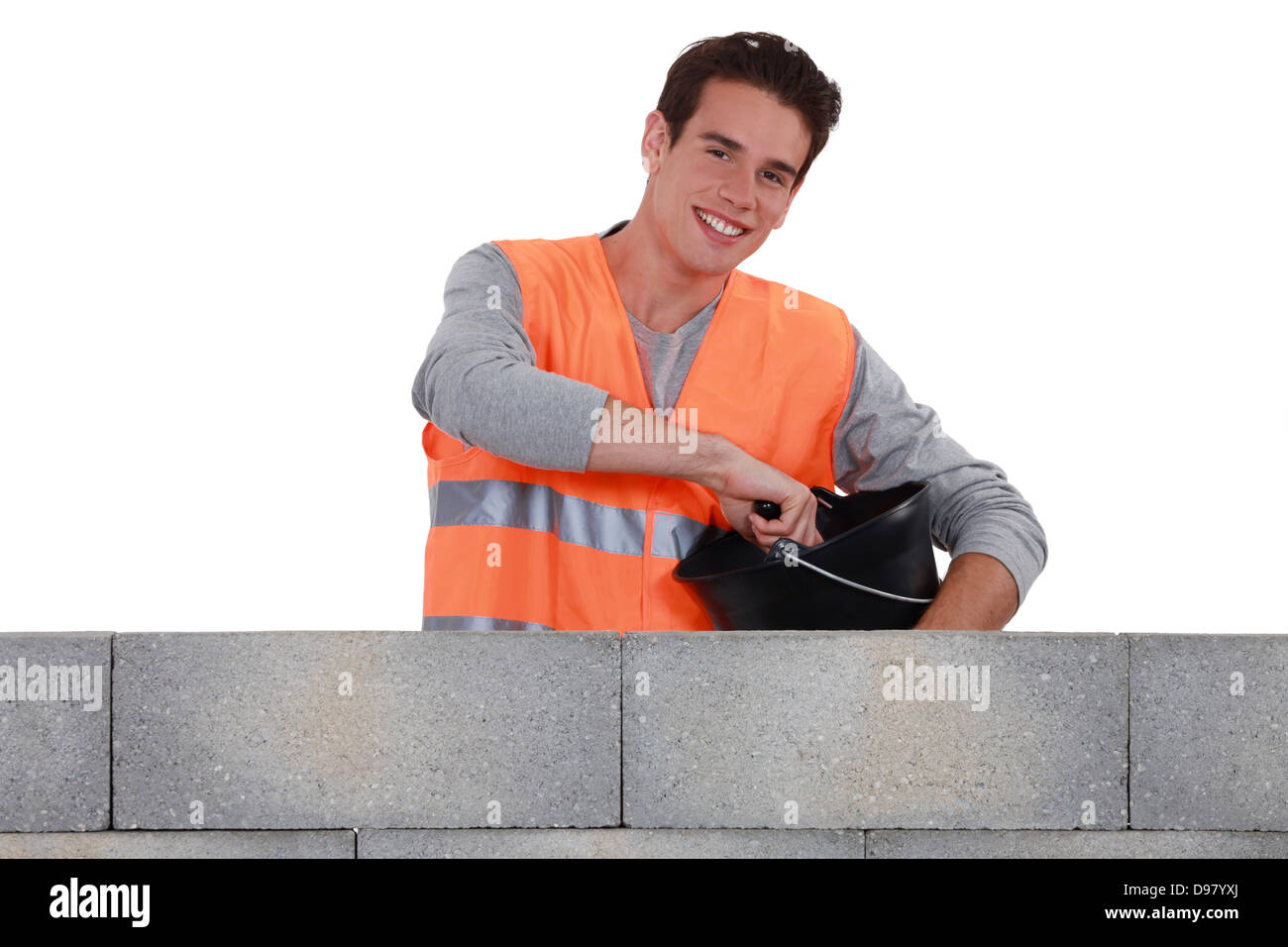 Mason with bucket and trowel Stock Photo - Alamy