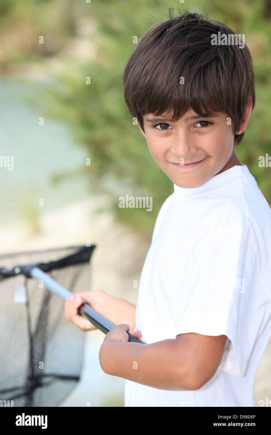 Boy with a fishing net Stock Photo - Alamy
