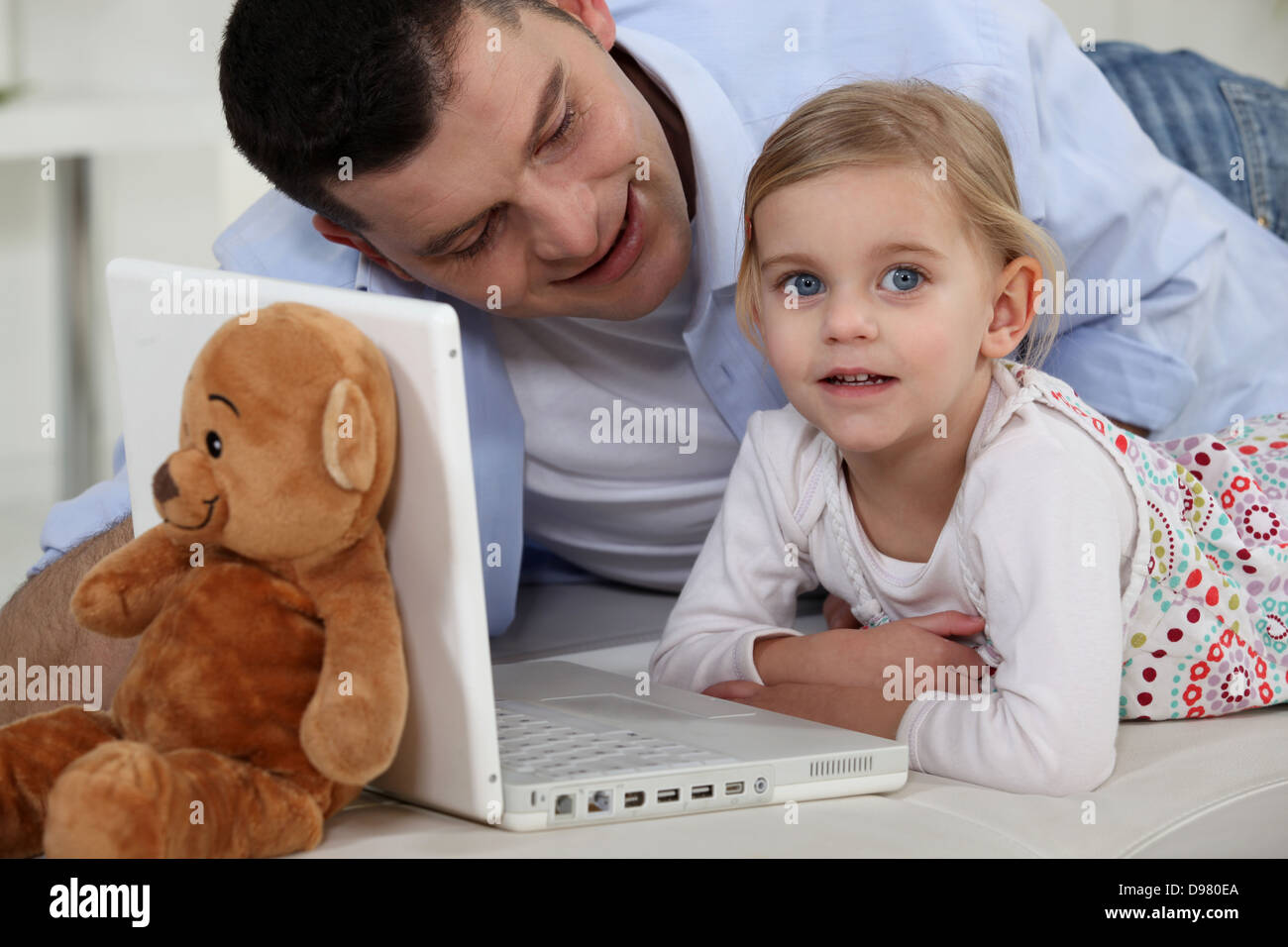 Father and daughter with laptop Stock Photo - Alamy