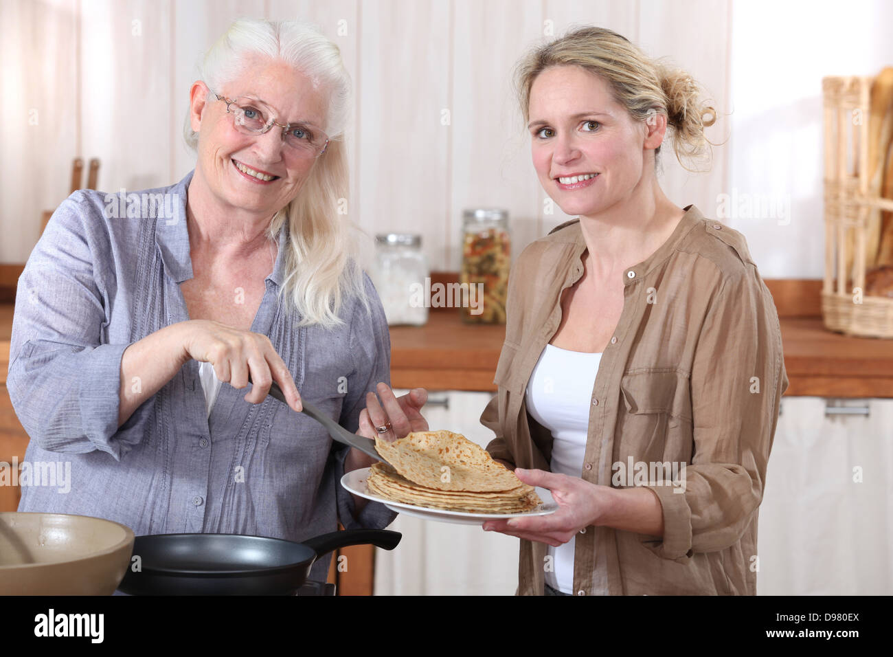 Women making crepes Stock Photo - Alamy