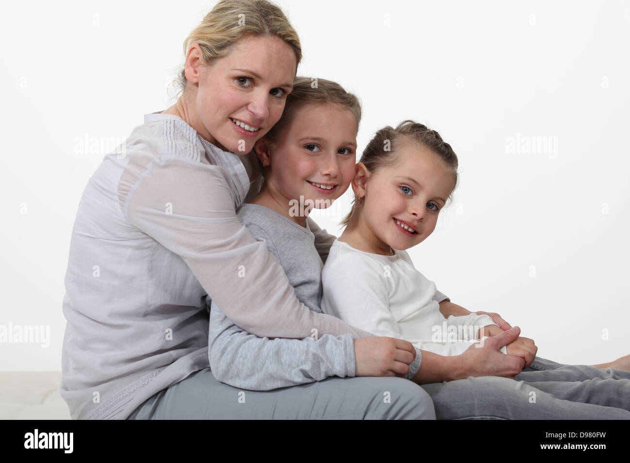 Mother with two daughters Stock Photo - Alamy