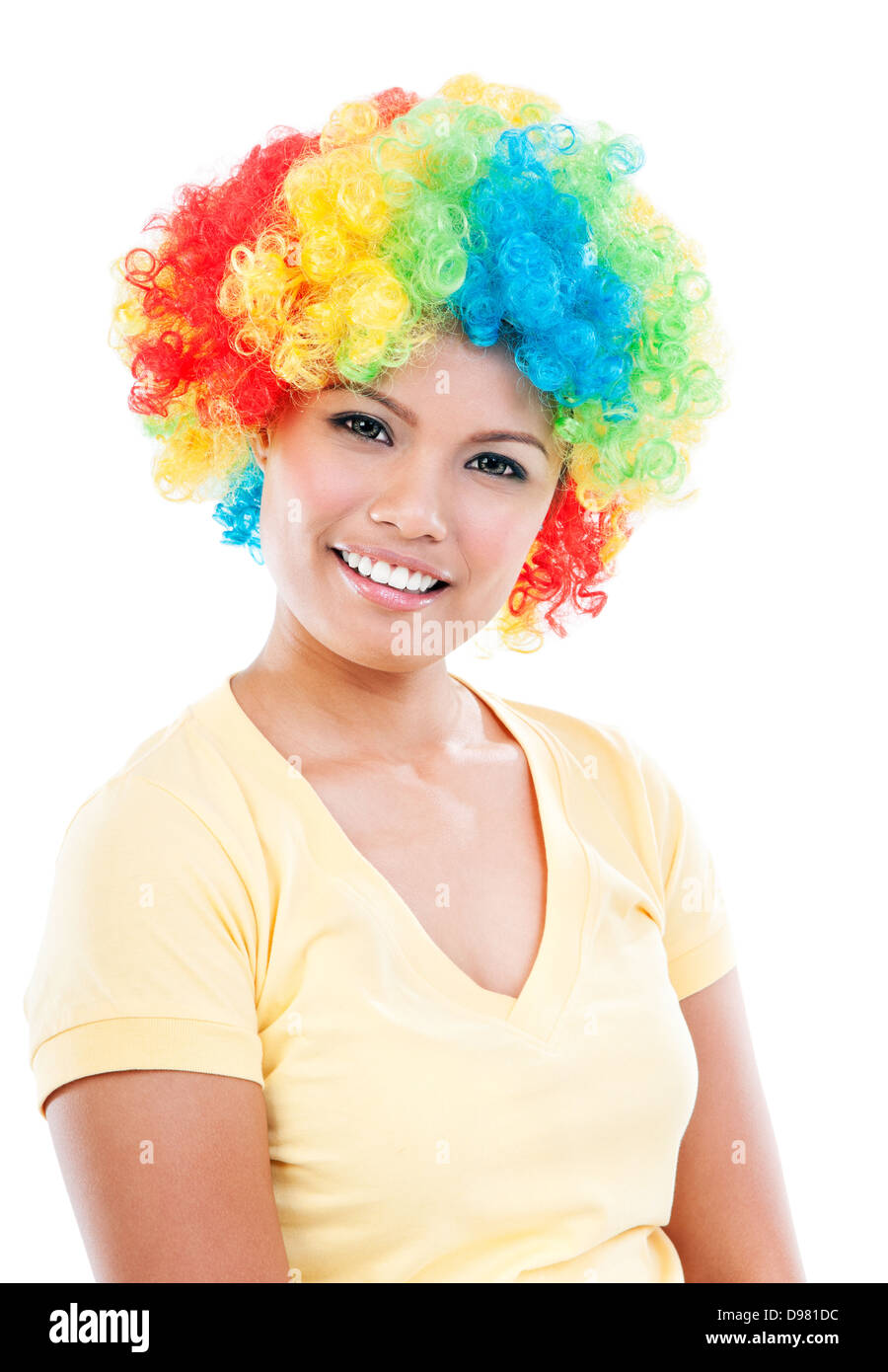 Cute young woman wearing colorful wig, portrait Stock Photo - Alamy