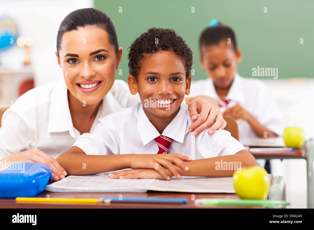 attractive elementary school teacher and students in classroom Stock ...