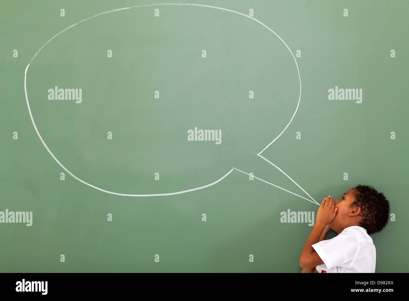 elementary schoolboy shouting at chat box drawn on chalkboard Stock ...