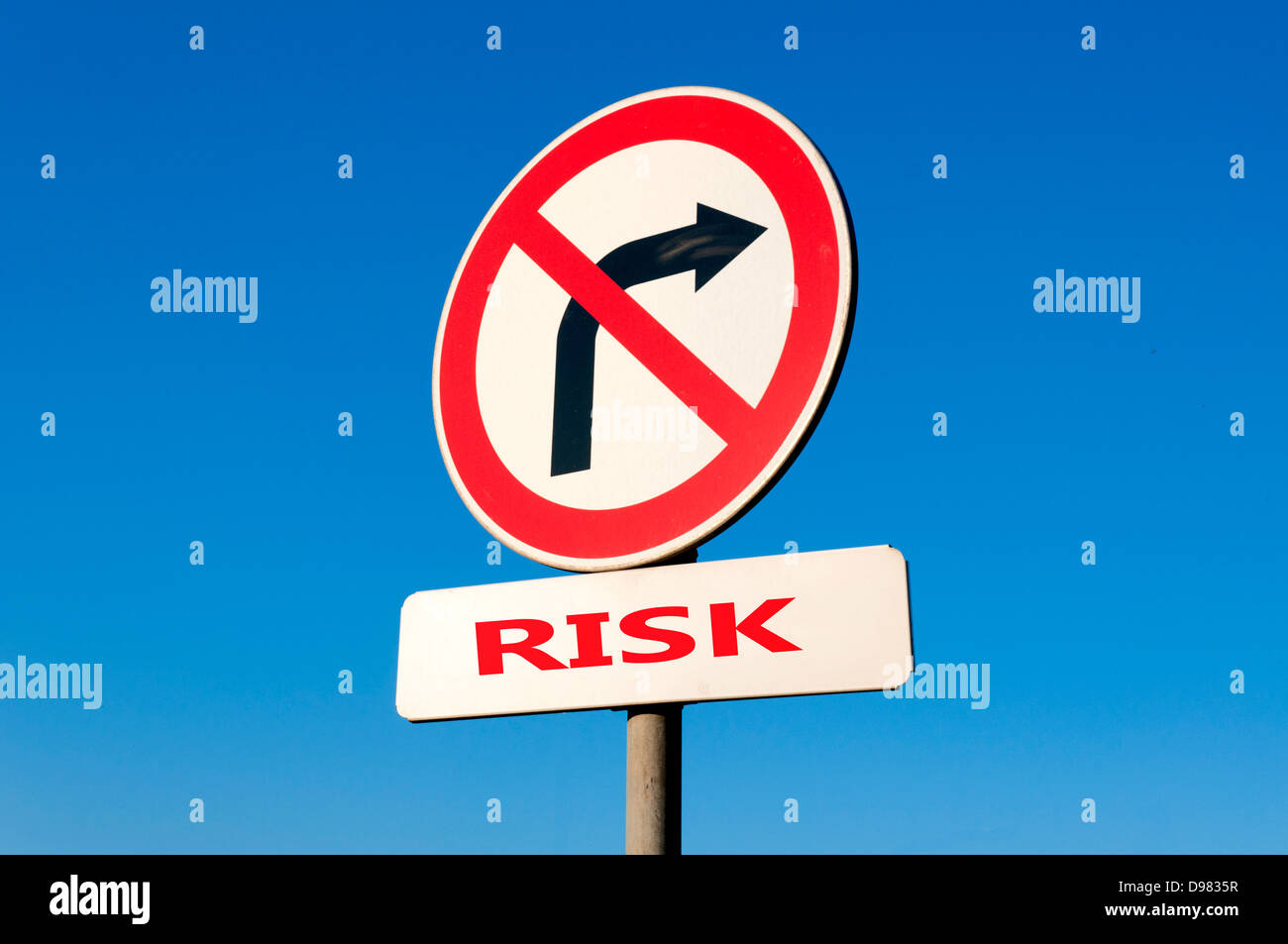 Risk on right traffic sign on blue sky Stock Photo - Alamy