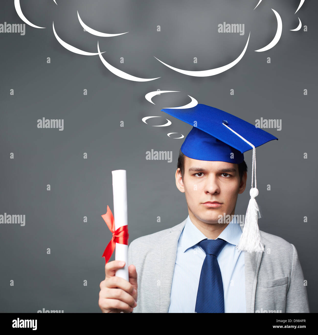 Portrait of confident student with graduation certificate looking at ...