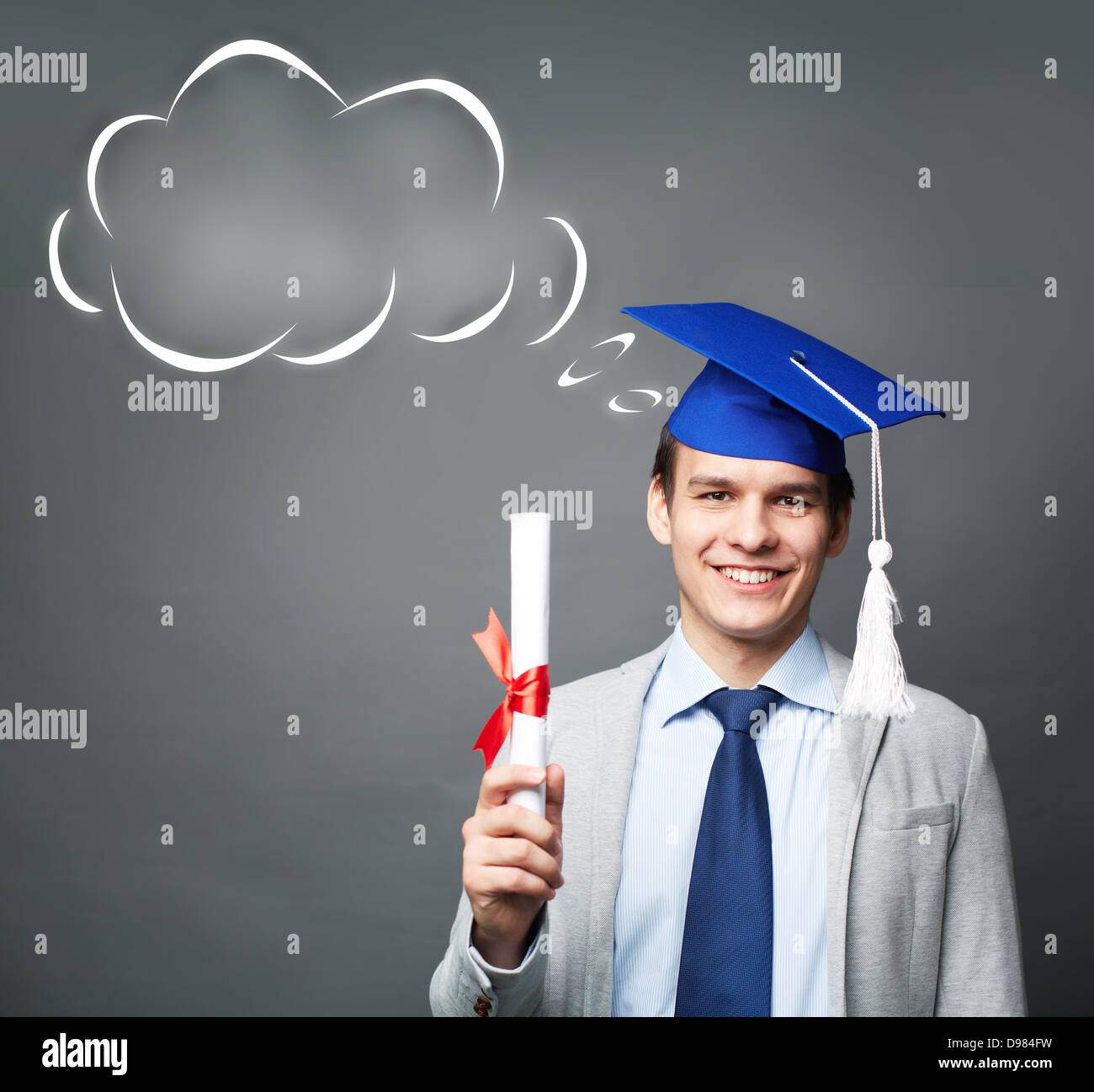 Portrait of confident student with graduation certificate looking at ...