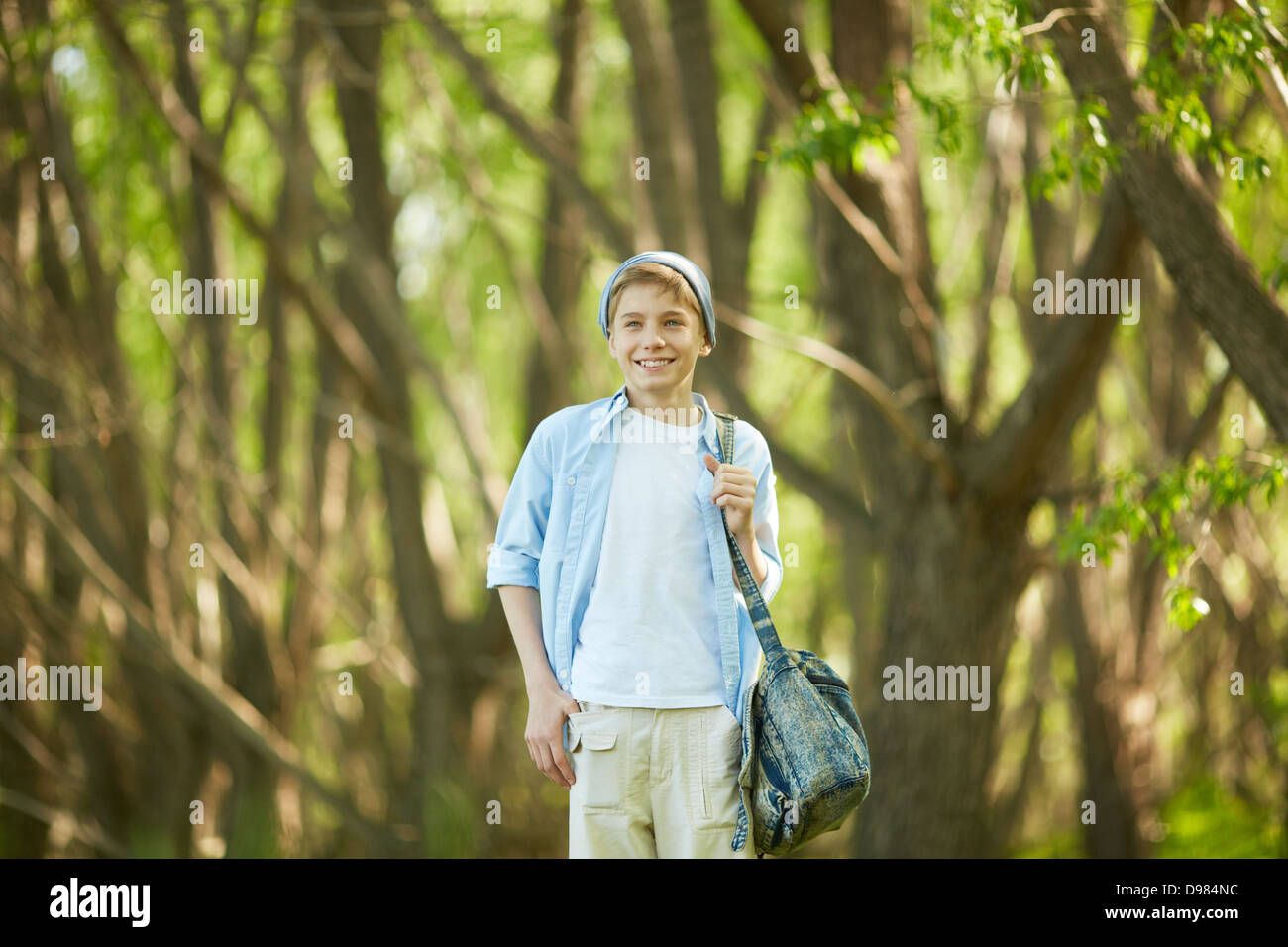 Portrait of cute lad in casual clothes outside Stock Photo - Alamy